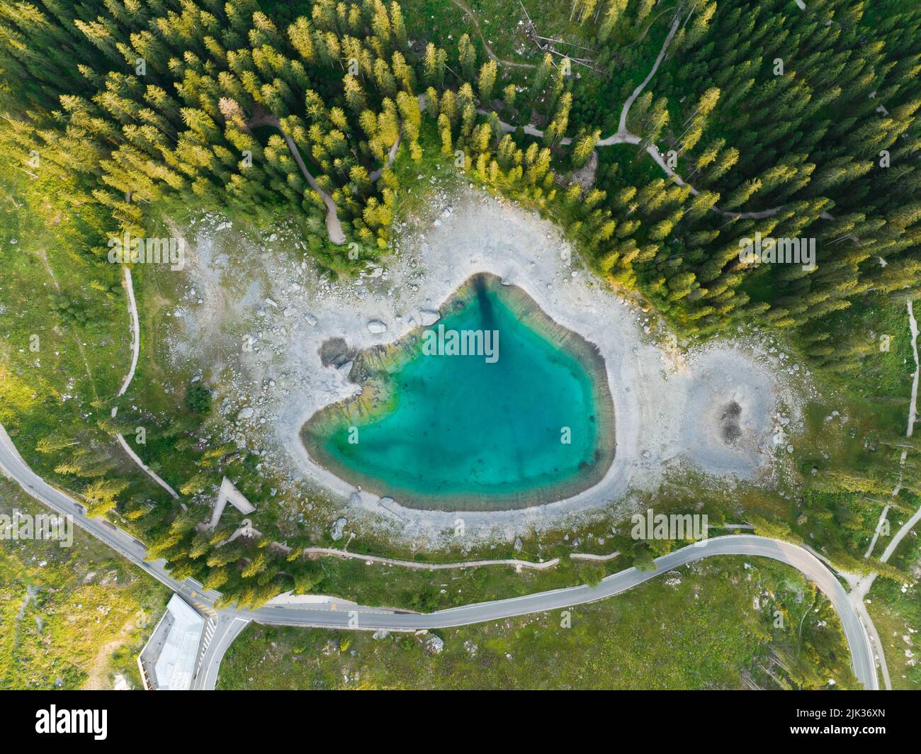 View from above, stunning aerial view of Carezza Lake (Lago di Carezza ...