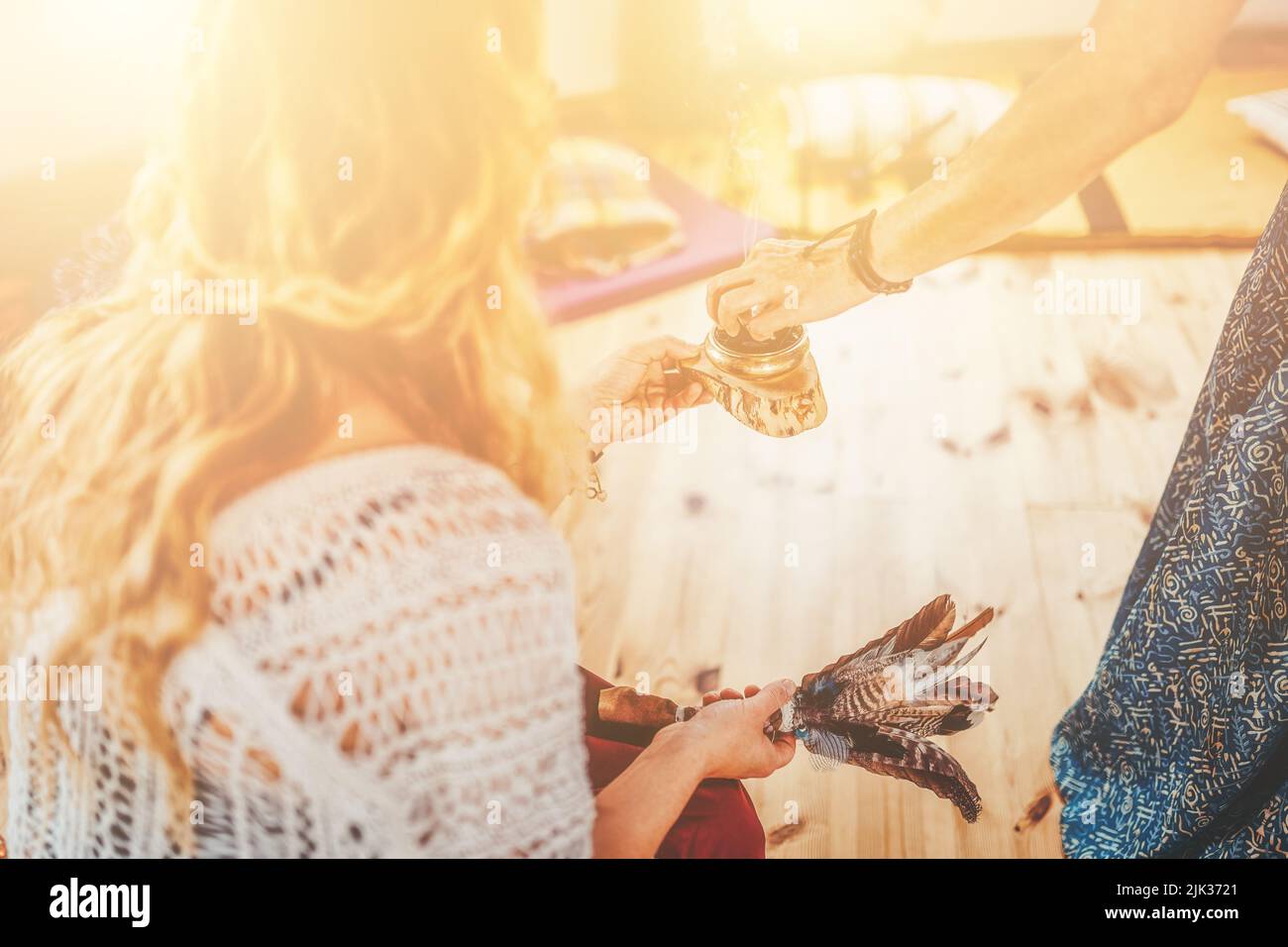 incense in a woman hand, ceremony space Stock Photo - Alamy