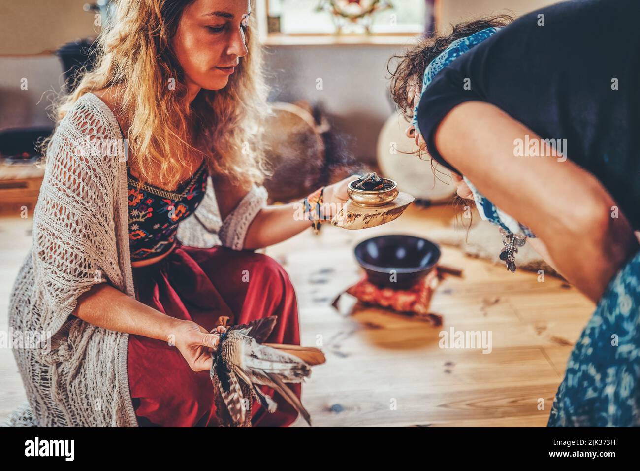incense in a woman hand, ceremony space Stock Photo - Alamy