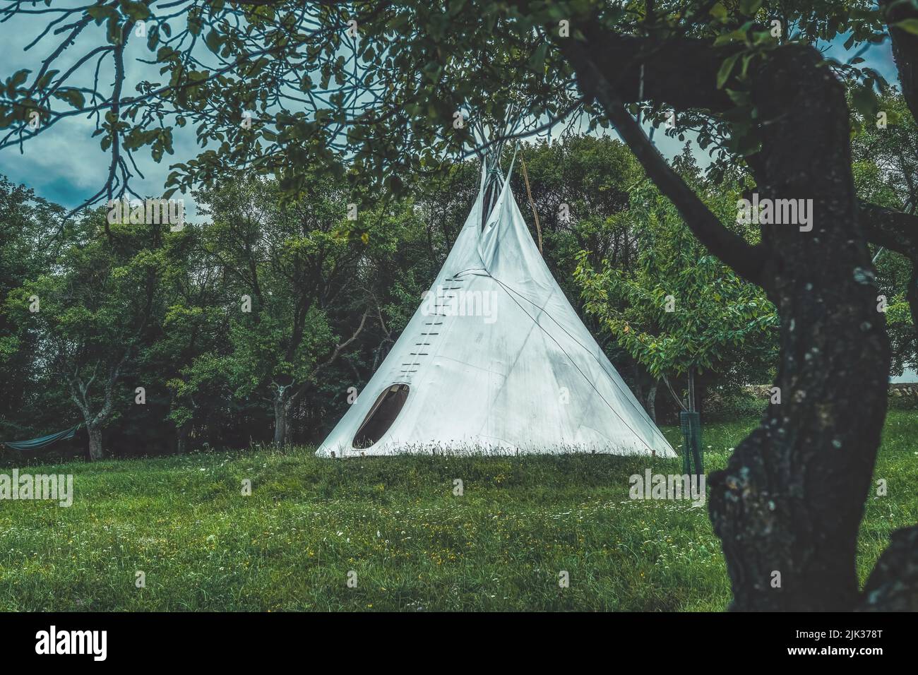 white teepee indian tent standing in beautiful landscape Stock Photo ...