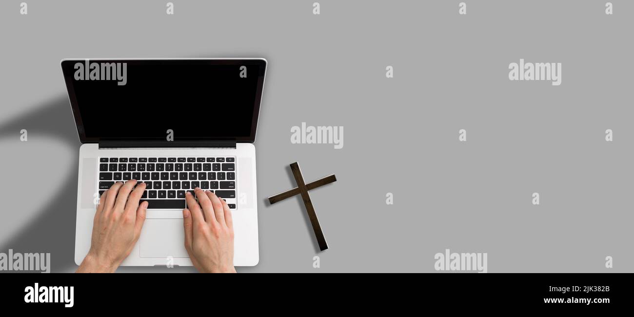 Holy Bible, laptop and cross on wooden background Stock Photo - Alamy
