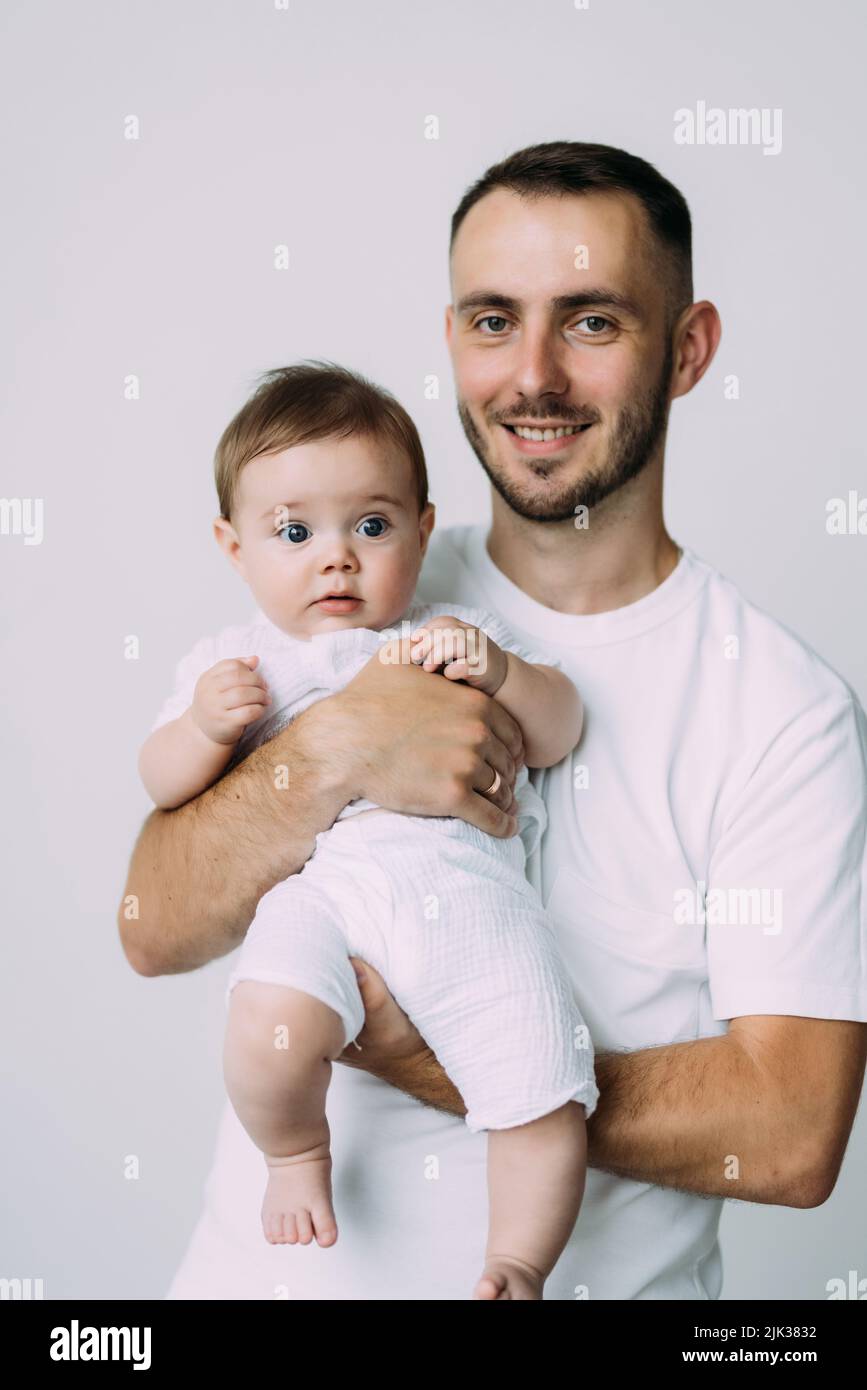 Handsome man with his son on white background Stock Photo - Alamy