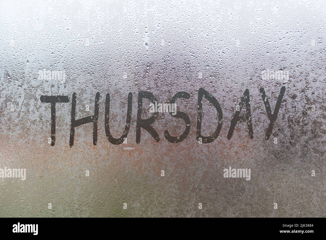 thursday written on the glass screen with raindrops background Stock ...