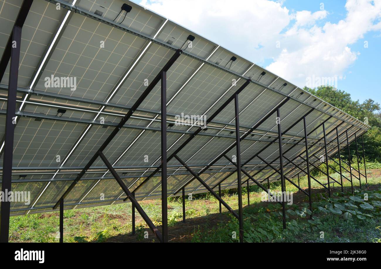 A rear view, bottom view of the solar panels mounted on the ground ...