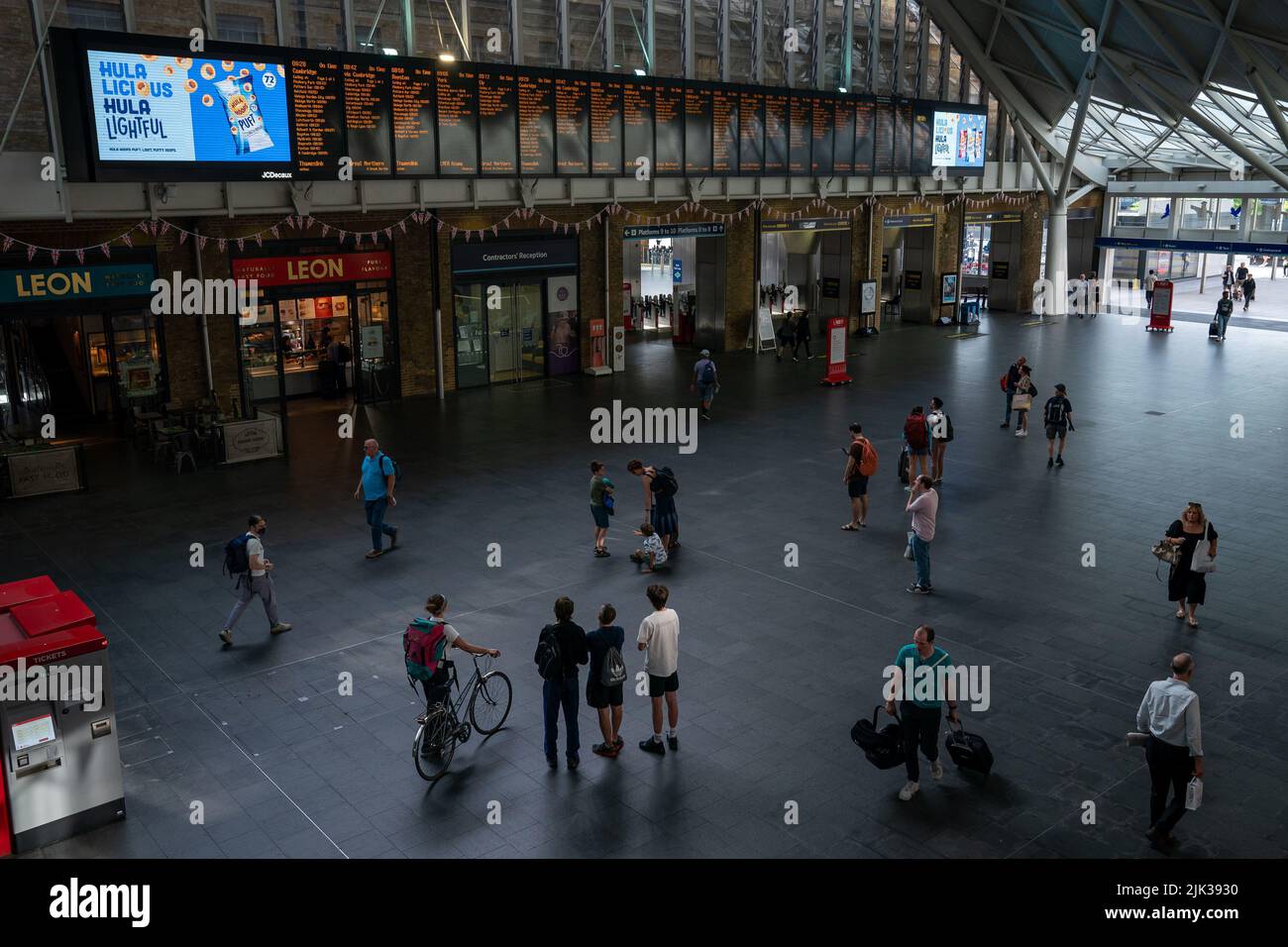 RETRANSMITTED WITH CORRECT CAPTION People in Kings Cross train station ...