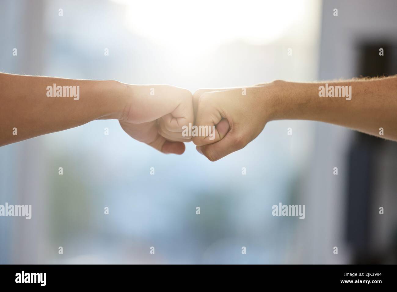 Weve got this in the bag. two unrecognizable businesspeople fist ...