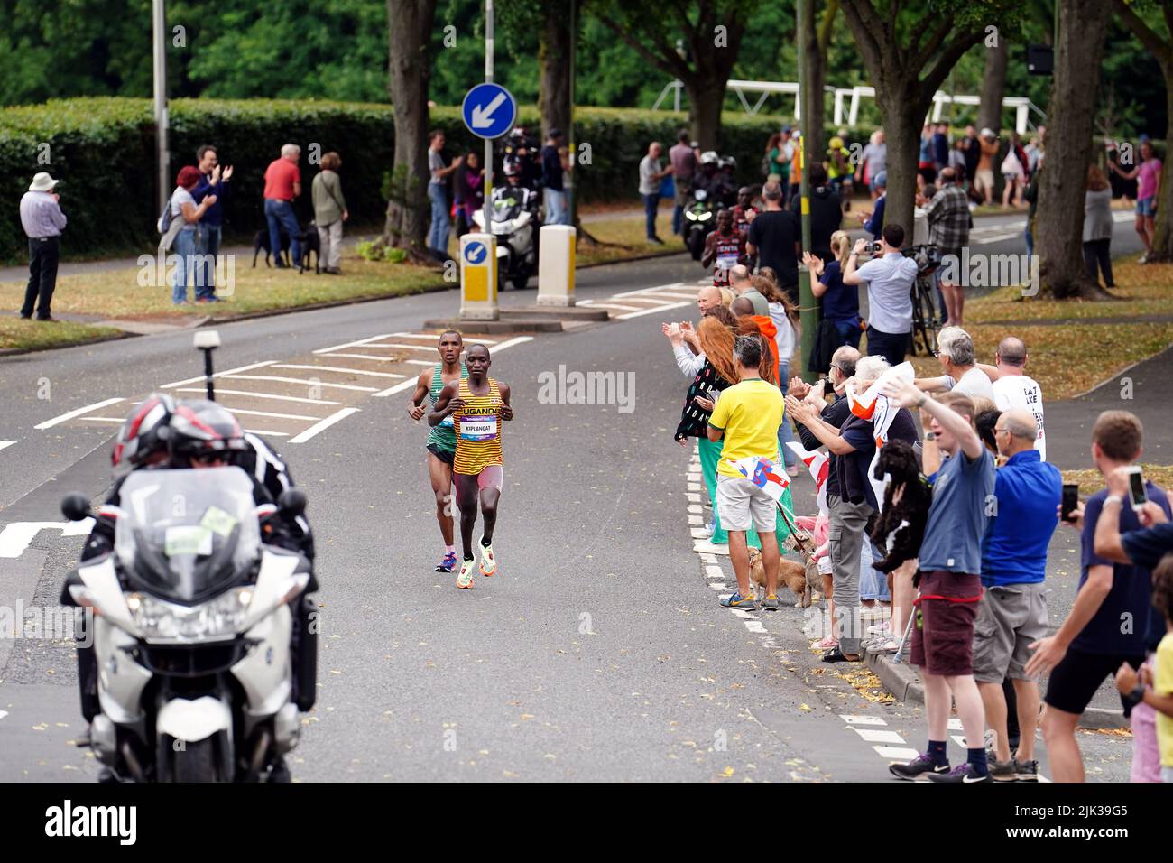 Uganda’s Victor Kiplangat and Tanzania's Alphonce Felix Simbu form a ...