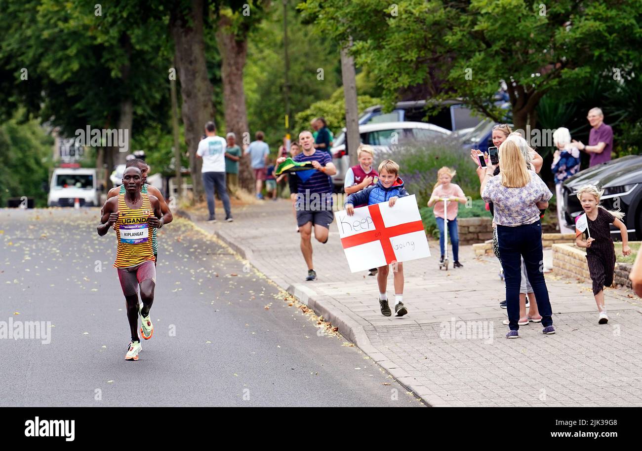 Uganda’s Victor Kiplangat and Tanzania's Alphonce Felix Simbu form a ...