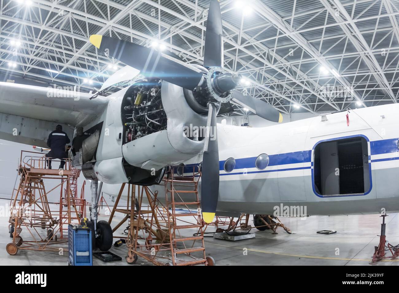 Transport turboprop airplane in the hangar. Close-up of an open ...