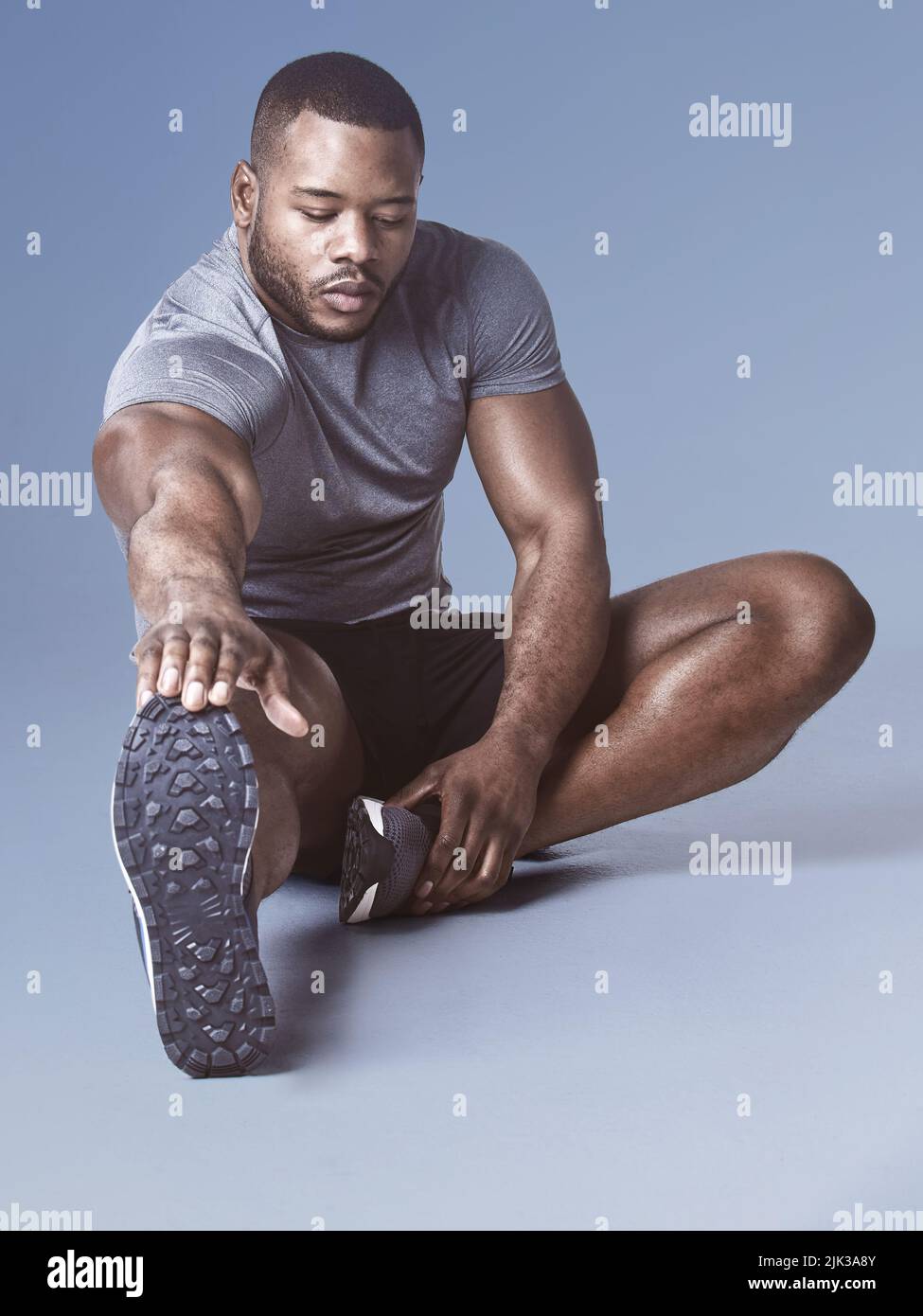 Nobody likes stiff muscles. Full length shot of a handsome young man ...