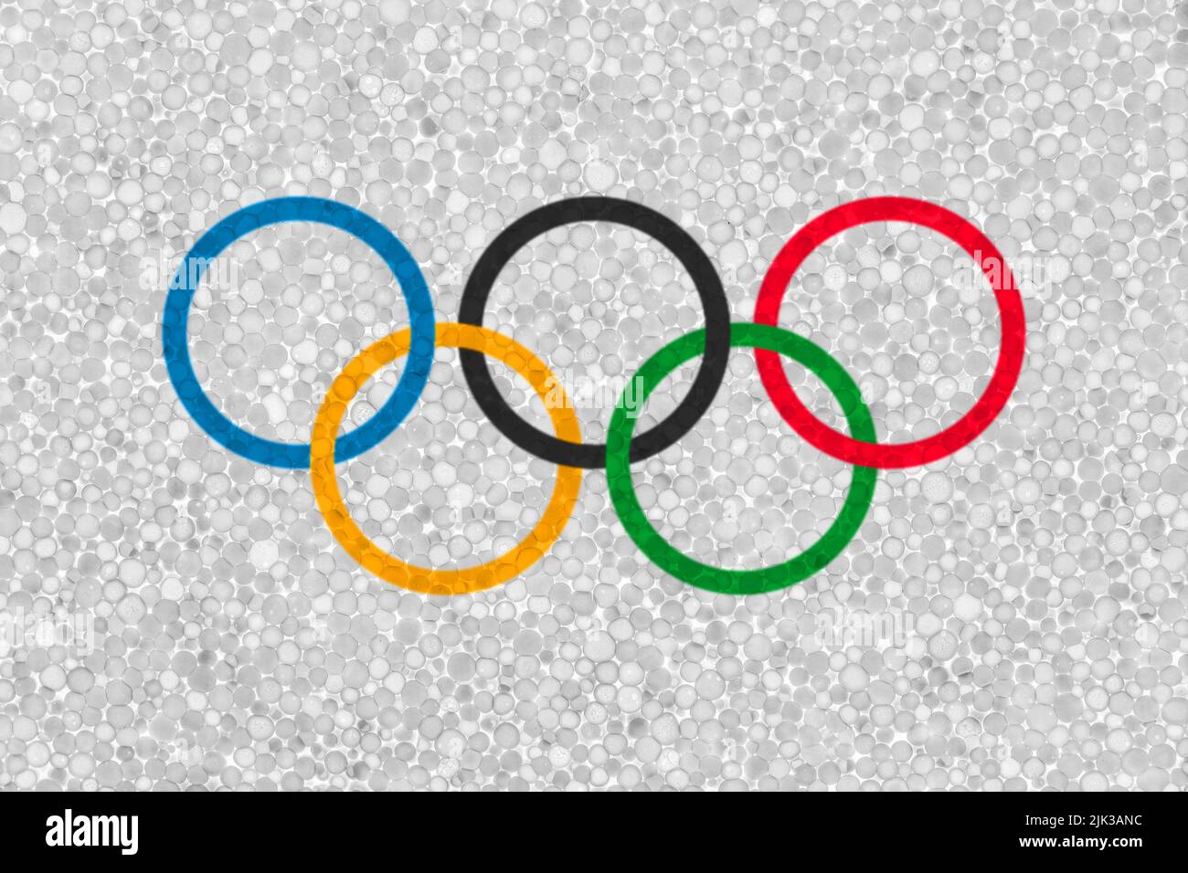 Olympic flag on styrofoam texture. flag painted on the surface of ...