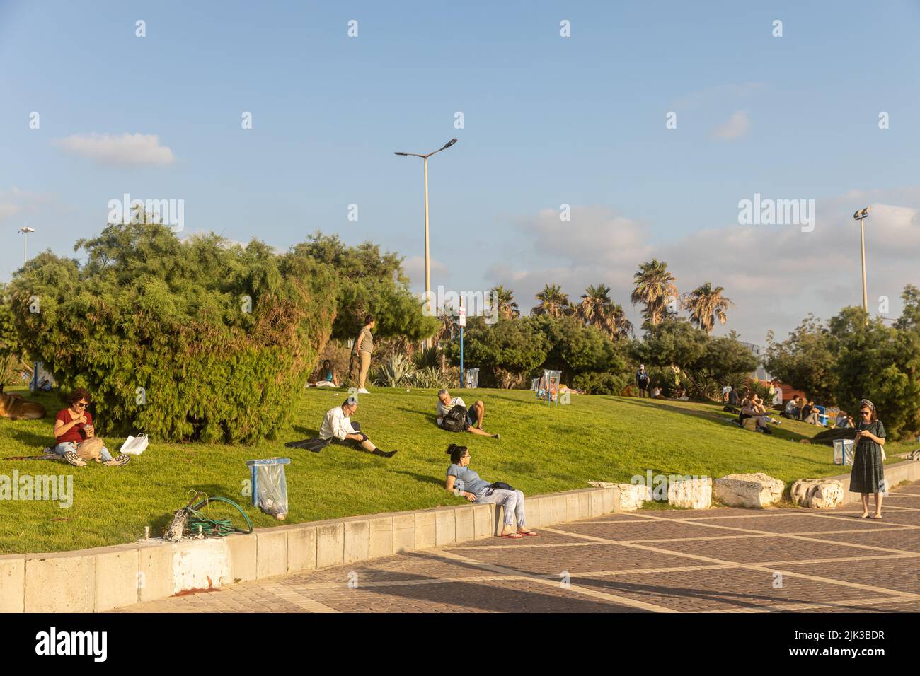 Haifa, Israel - 20 July 2022, People rest on a hill near Dado Beach ...