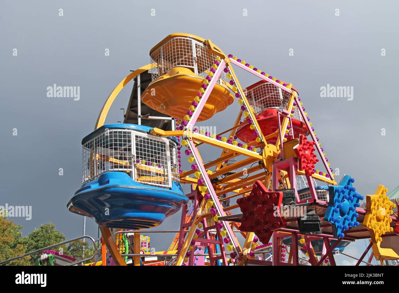 A Small Childrens Fun Fair Wheel Ride Stock Photo - Alamy