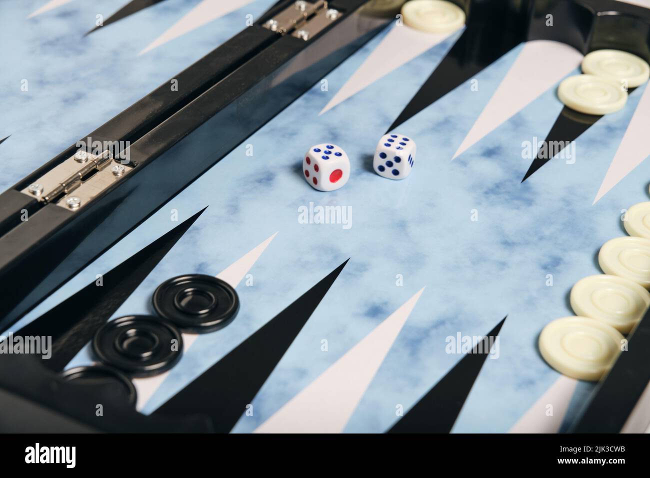 Board with cubes and chips for playing backgammon Stock Photo - Alamy