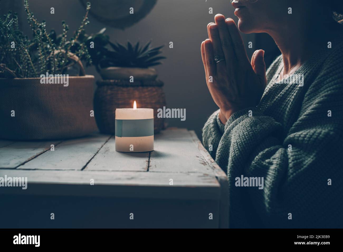 Concept of inner life balance and meditation with woman praying with ...