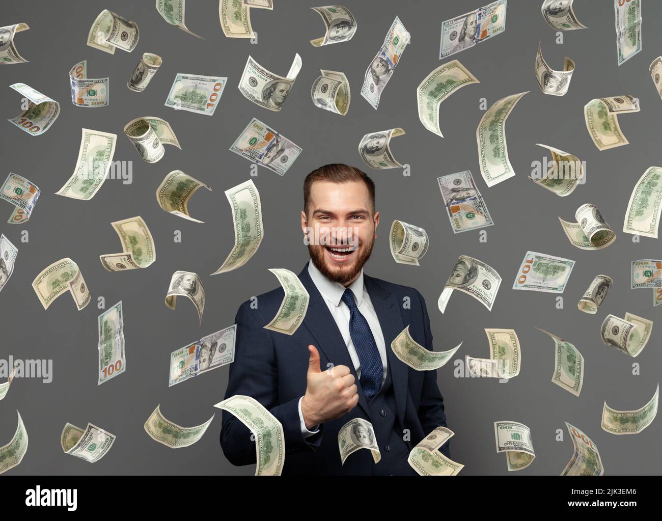 Successful confident excited businessman under American dollar money ...