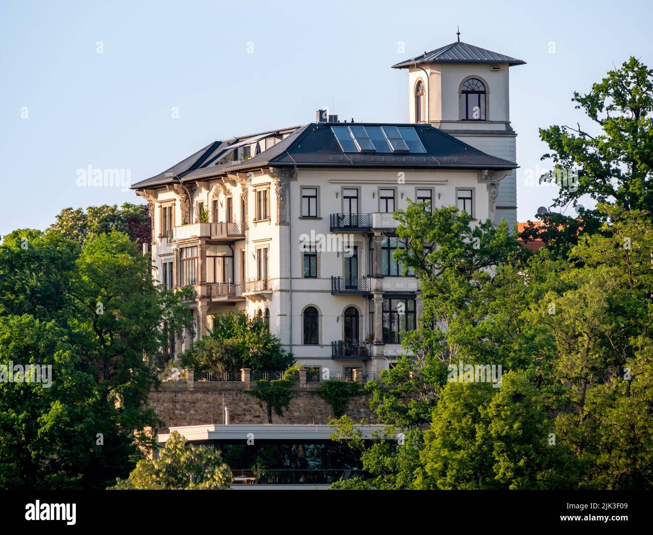 Beautiful villa building in good condition in the city. Green trees in ...