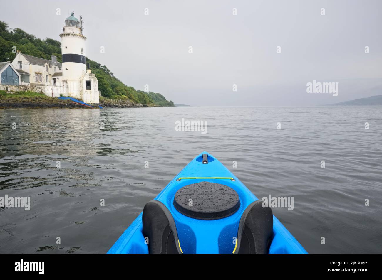 Cloch Lighthouse and blue kayak on open water at Firth of Clyde Stock ...