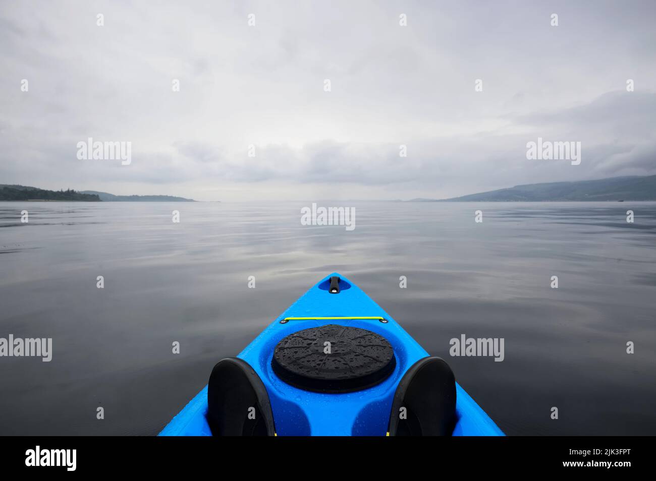 Blue kayak on open water at Firth of Clyde Stock Photo - Alamy
