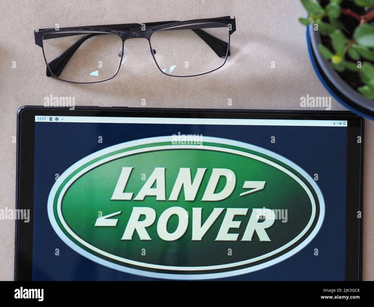 In this photo illustration, Land Rover logo seen displayed on a tablet ...