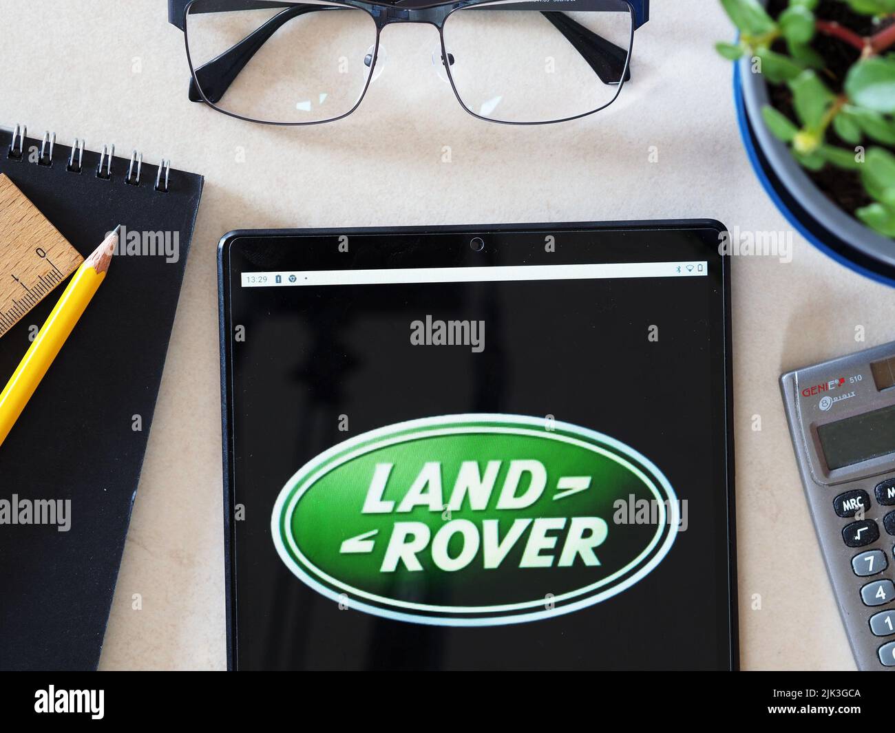 In this photo illustration, Land Rover logo seen displayed on a tablet ...