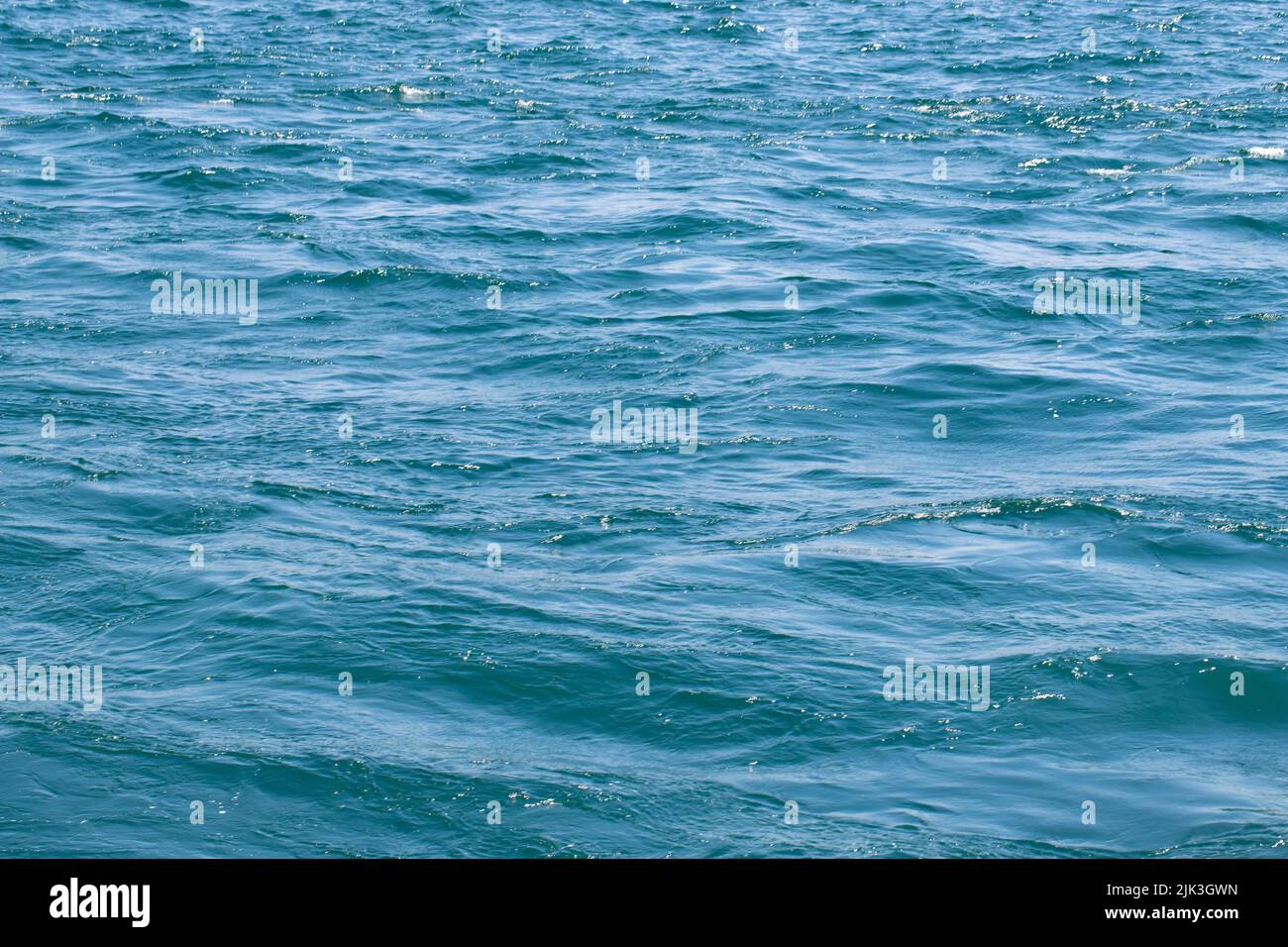 Sea surface. Turquoise sea water. Close up blue water surface at deep ...