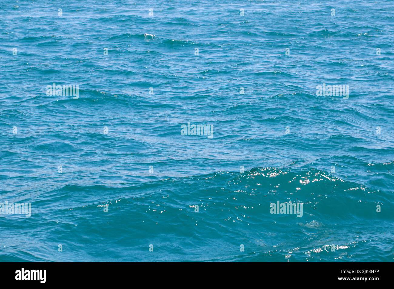 Sea surface. Turquoise sea water. Close up blue water surface at deep ...