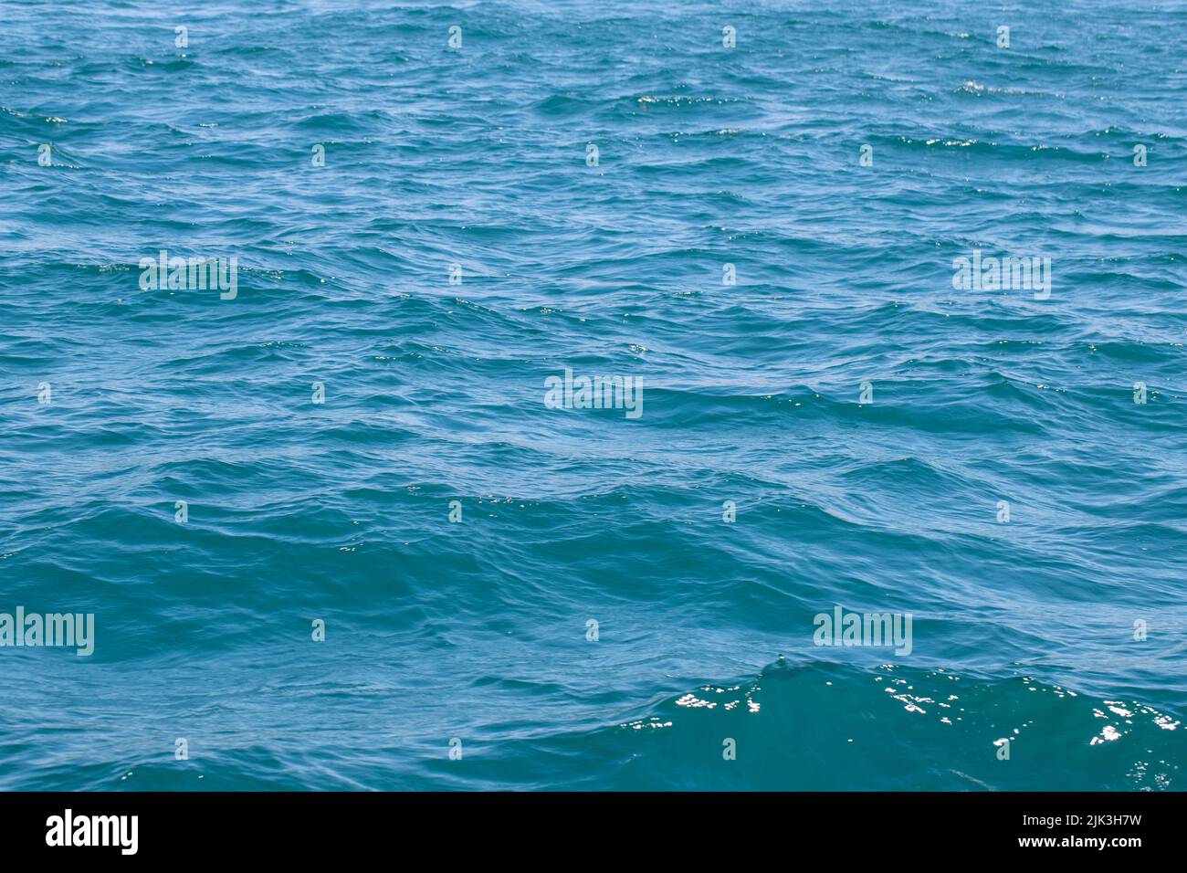 Sea surface. Turquoise sea water. Close up blue water surface at deep ...