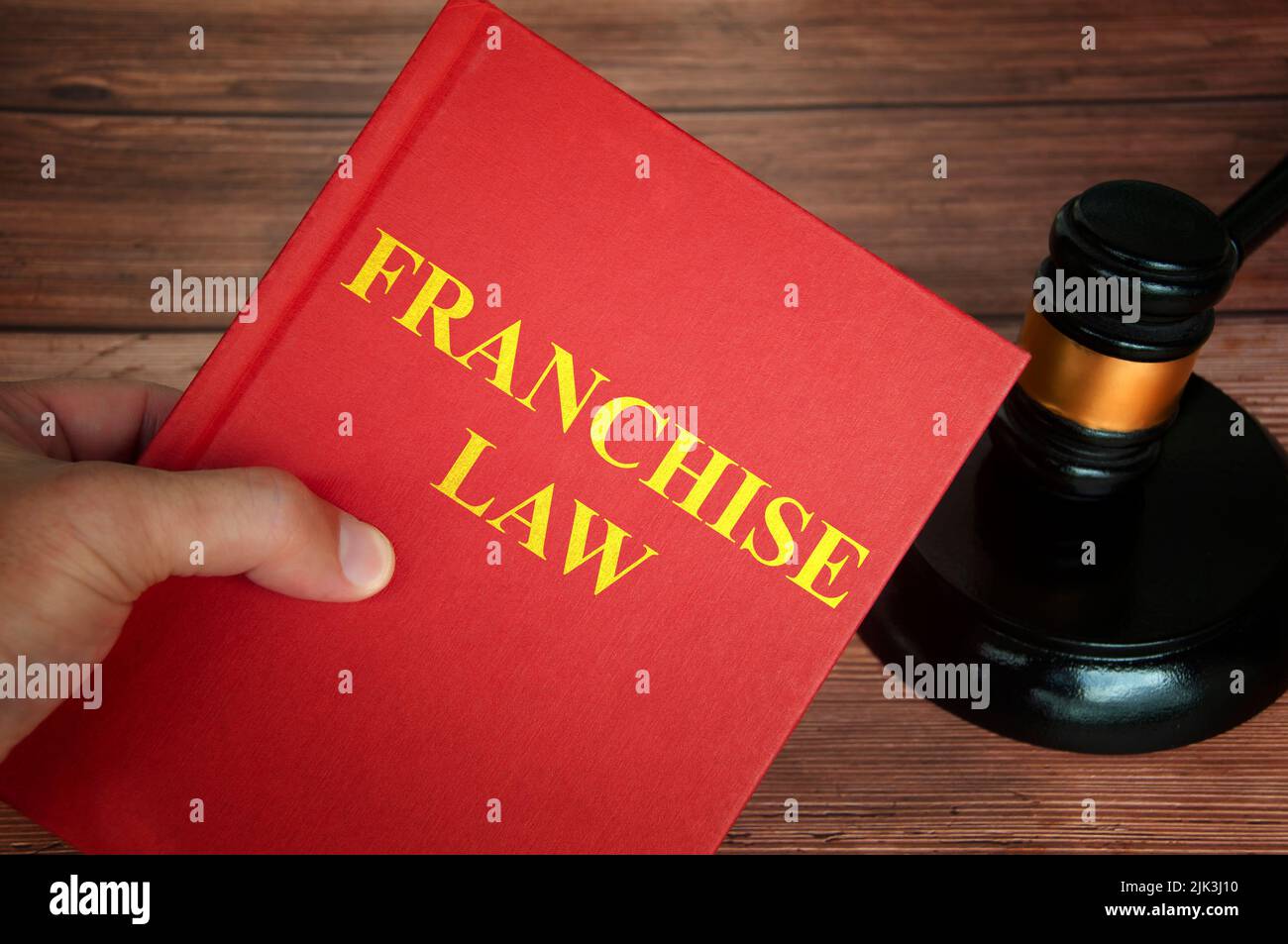 Franchise law text on law book with judge gavel on wooden desk ...