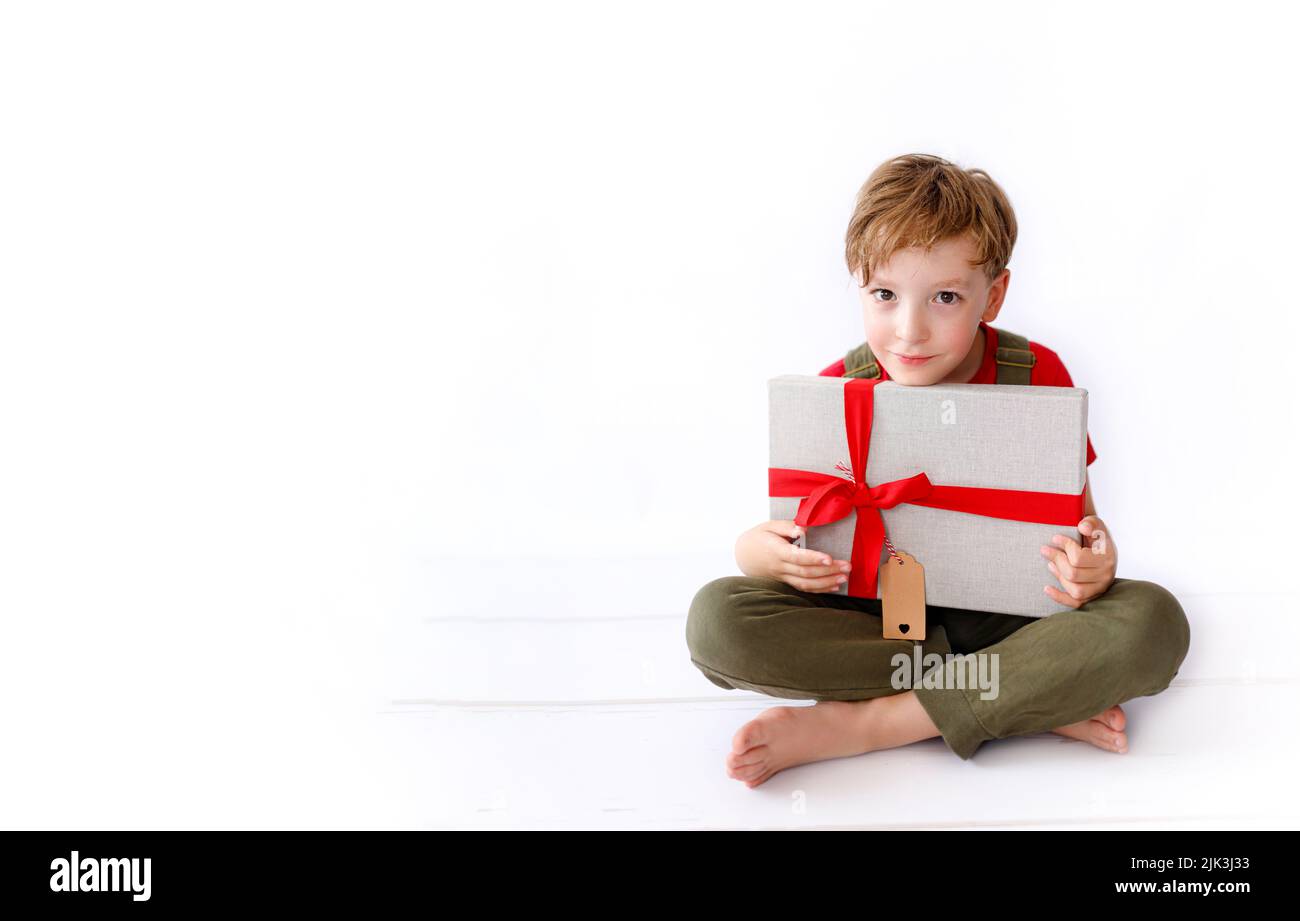 Young Boy Smiles with his Christmas Present Stock Photo - Alamy