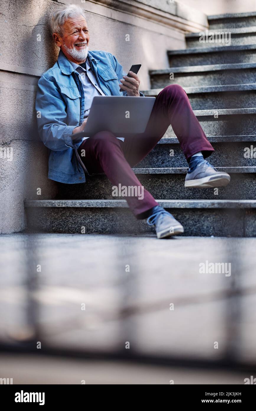 Laptop on stairs hi-res stock photography and images - Alamy
