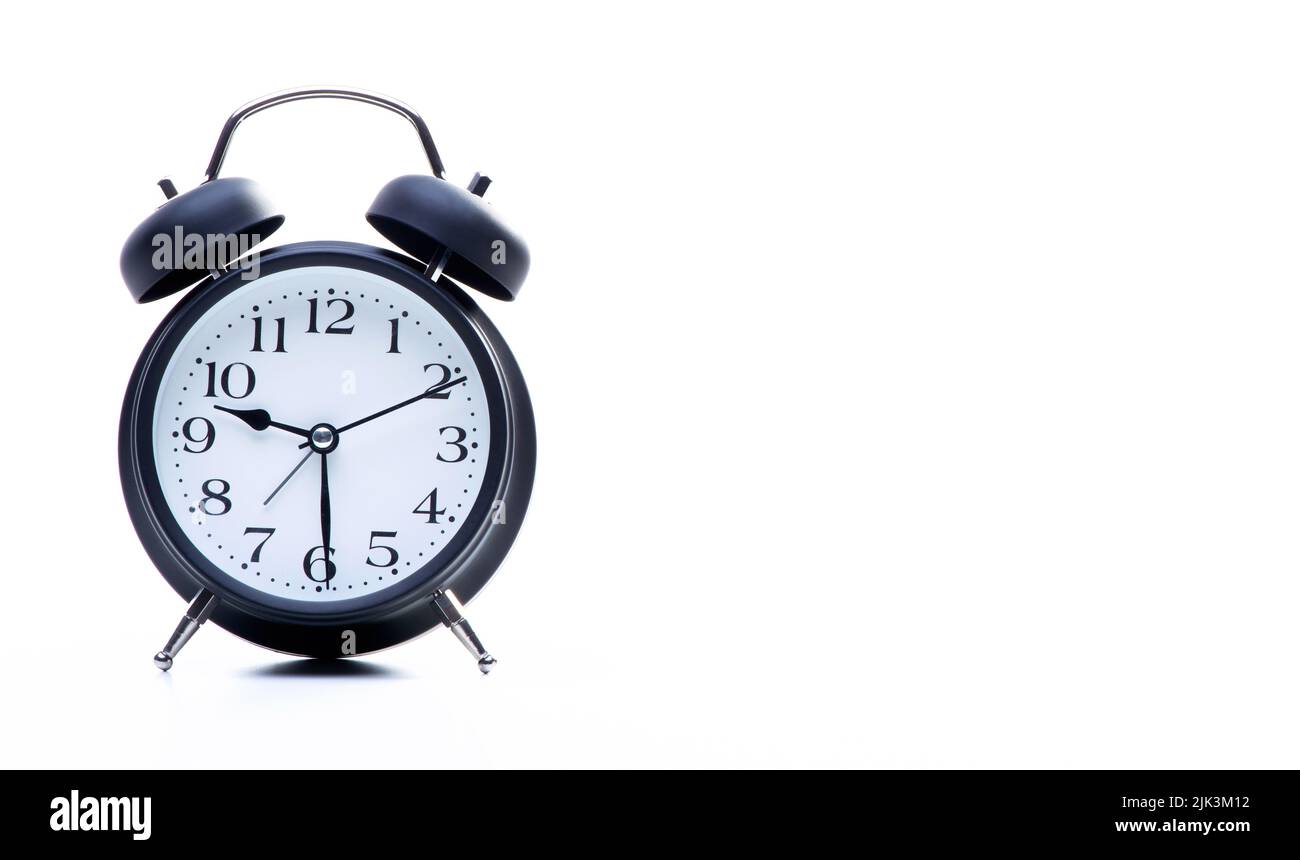 Black round metallic retro alarm clock isolated on white background ...