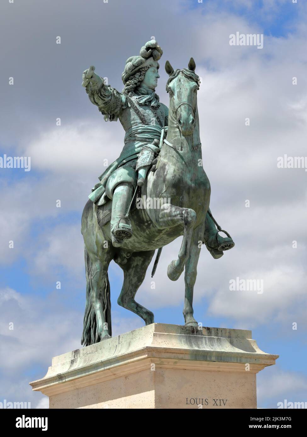 Bronze statue of Louis XIV (Sun King) in front of the palace of ...