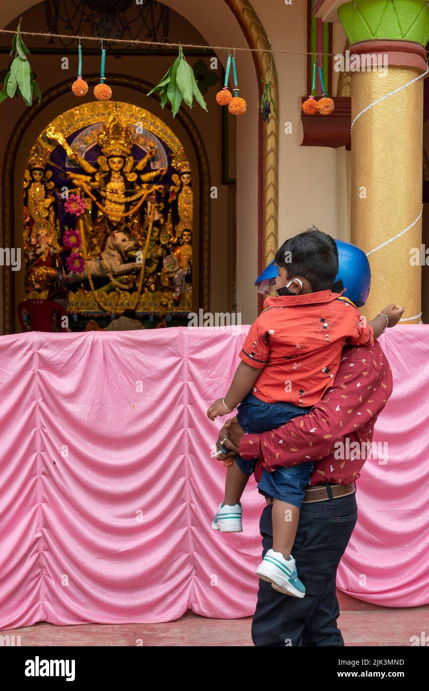 Howrah,India -October 26th,2020 : Father with helmet on, showing ...