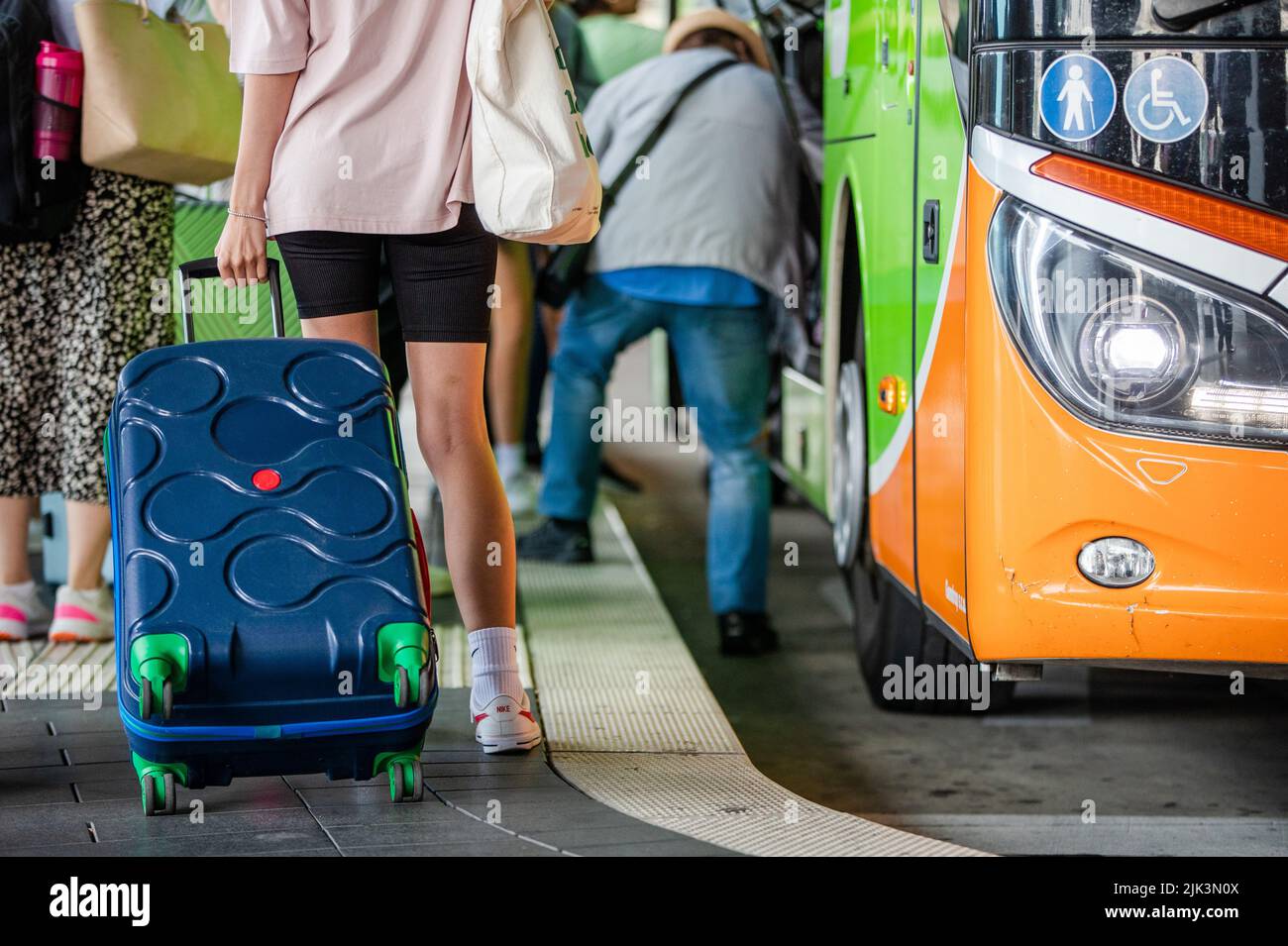 Stuttgart, Germany. 30th July, 2022. Passengers wait for their long ...