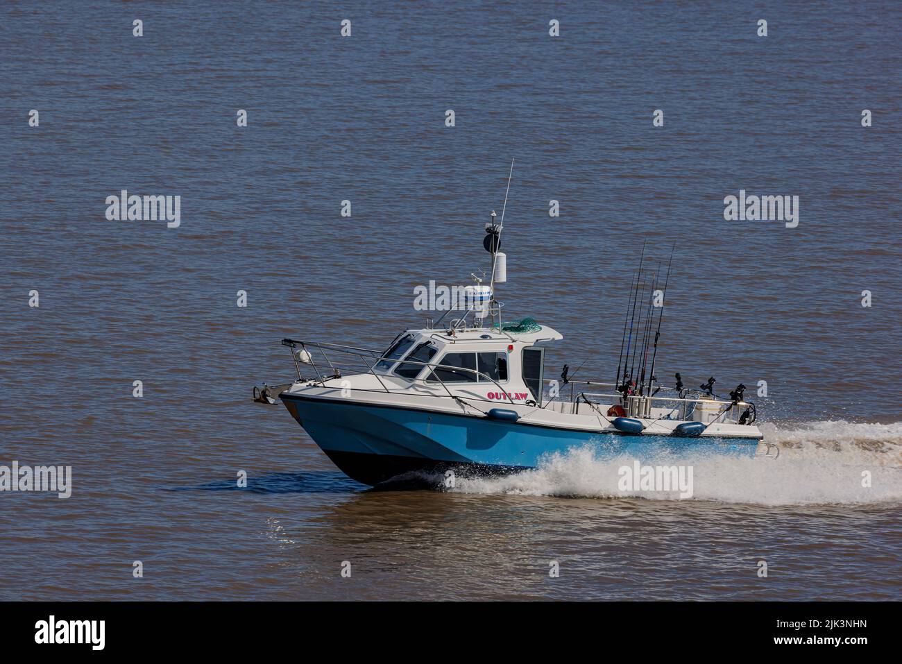 Fishing boat moving Stock Photo - Alamy