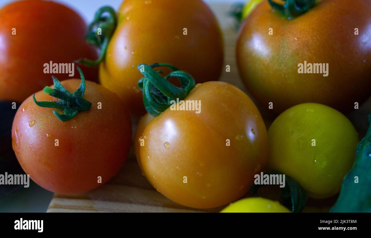 Locally grown tomatoes, ready for a rustic salad Stock Photo - Alamy