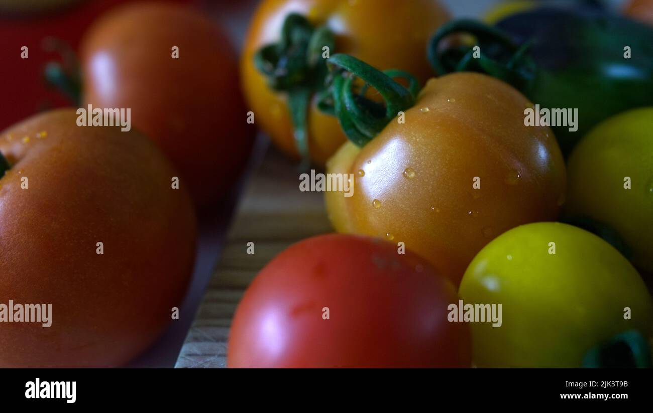 Locally grown tomatoes, ready for a rustic salad Stock Photo - Alamy