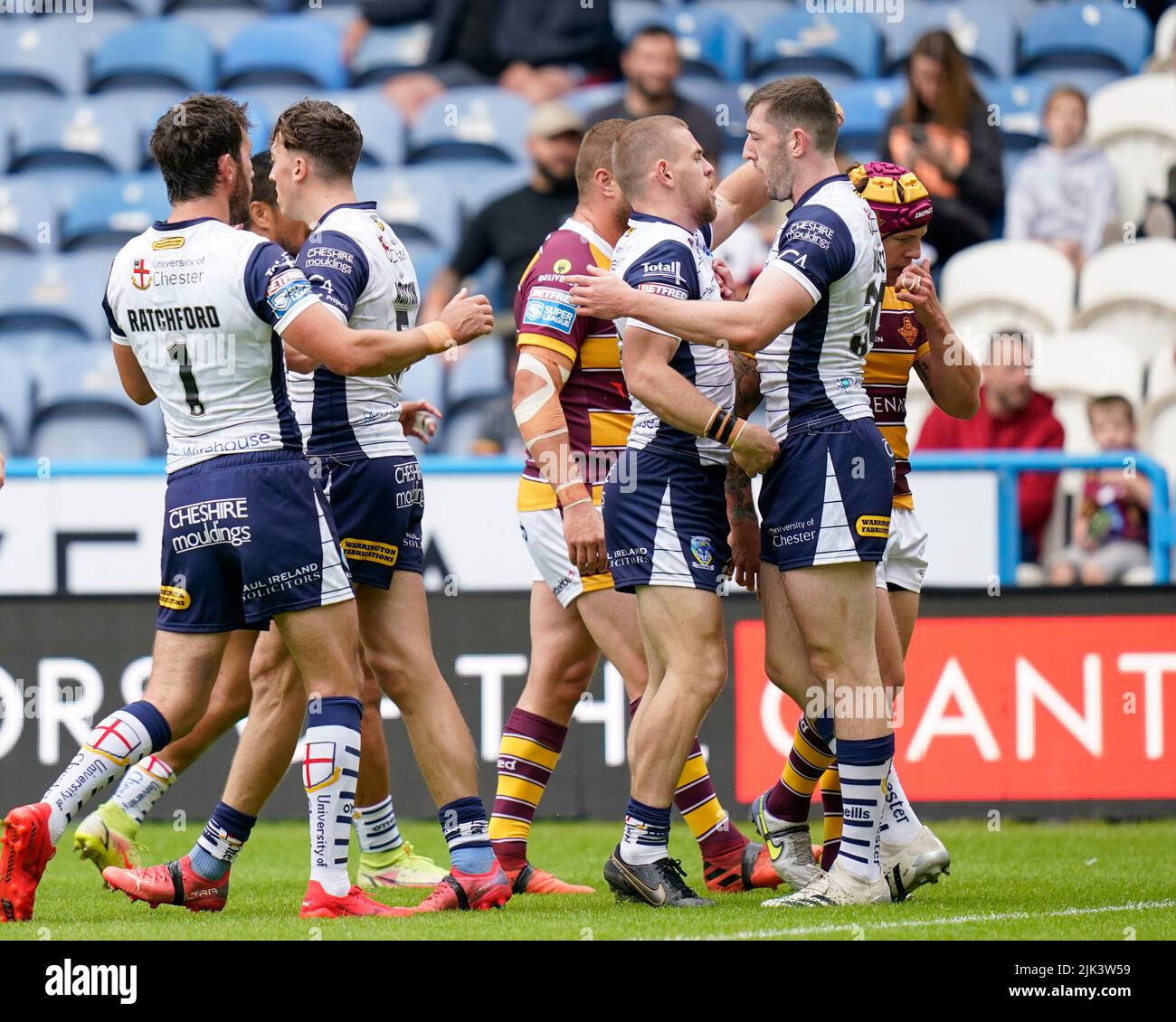 Matt Dufty #36 of Warrington Wolves celebrates with try scorer Jake ...