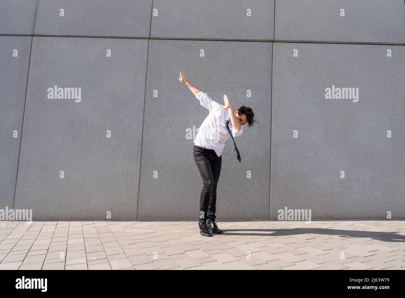 Happy and handsome adult businessman wearing elegant suit doing ...