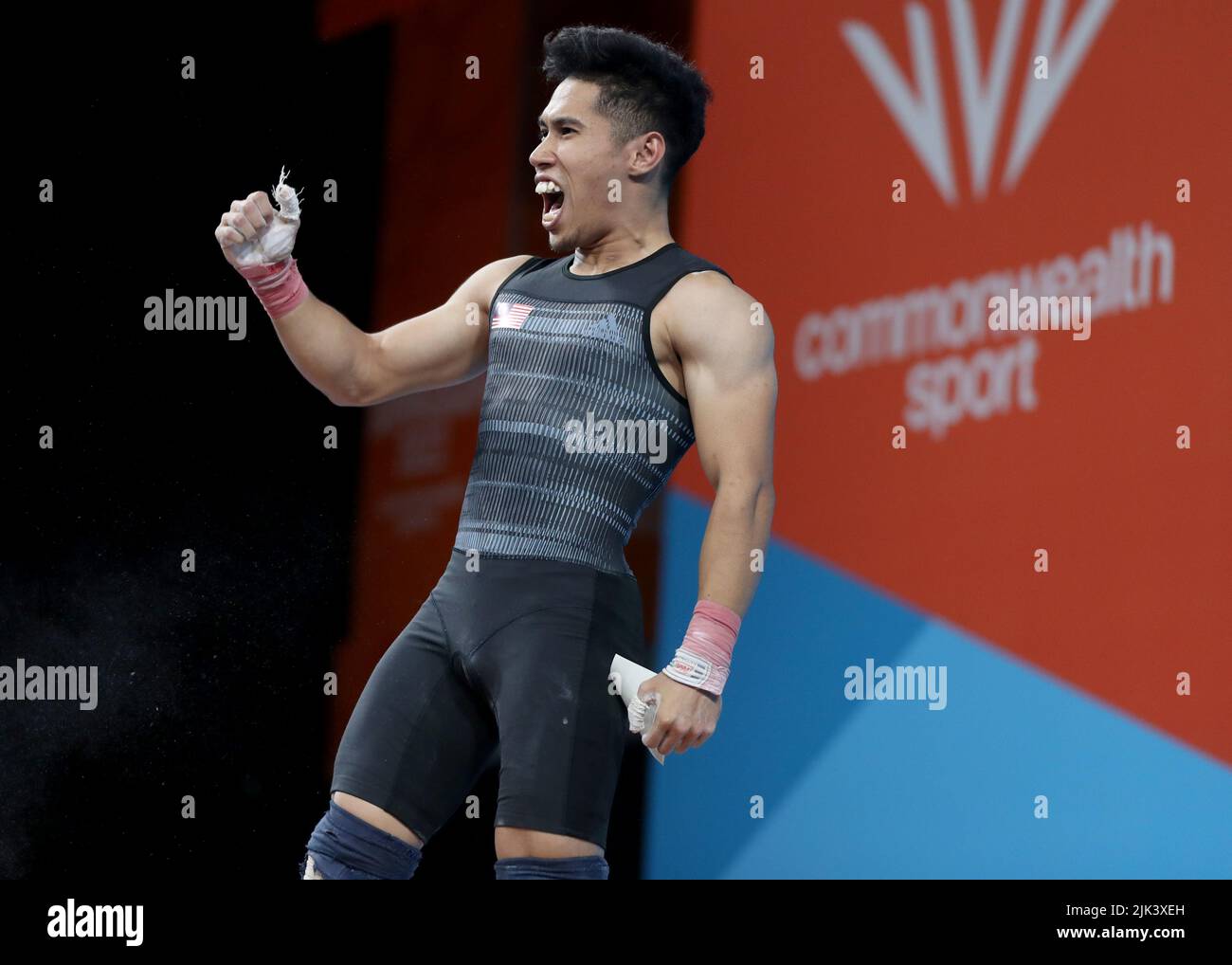 Malaysia’s Aznil Bin Bidin Muhamad celebrates in the Mens 61kg ...