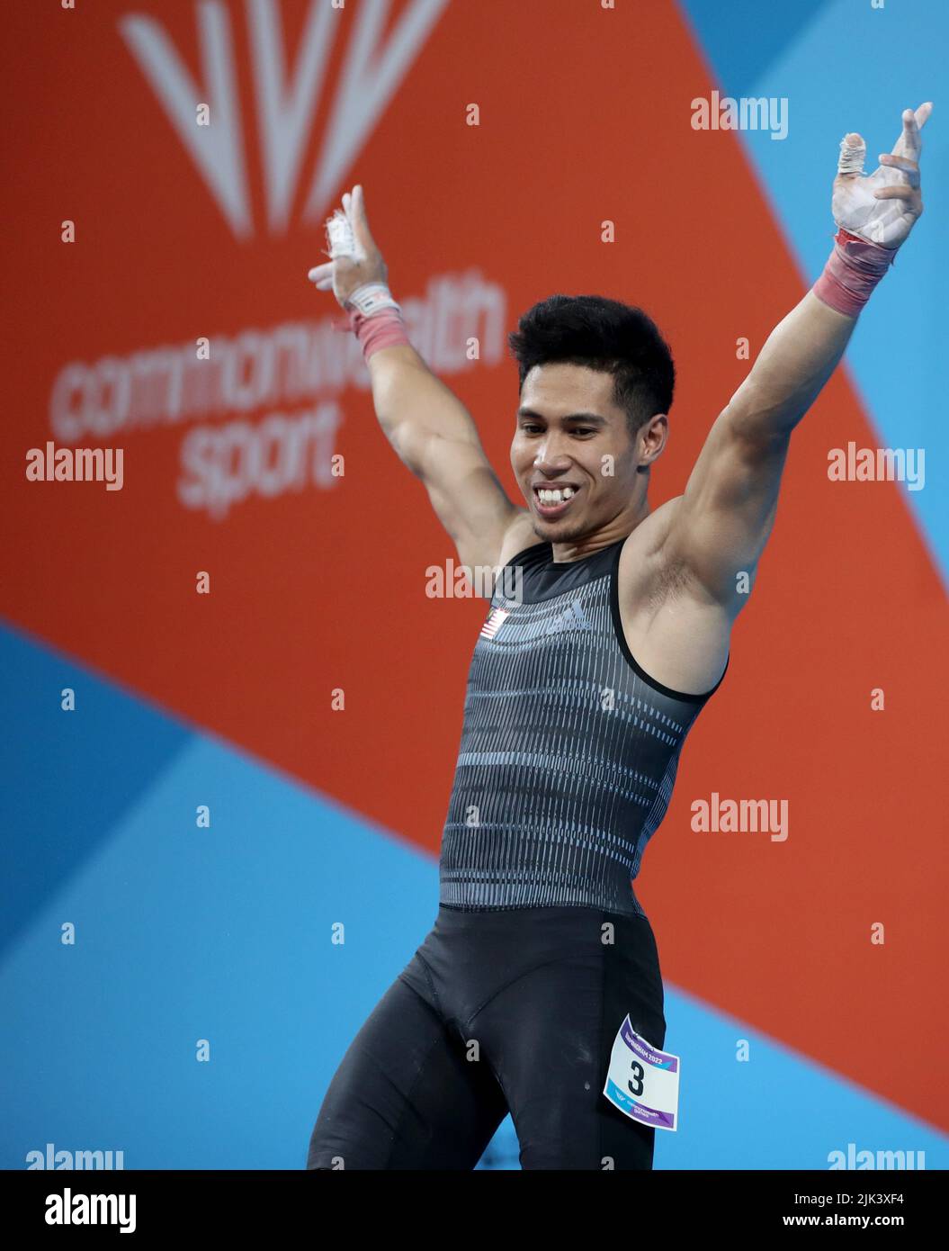 Malaysia’s Aznil Bin Bidin Muhamad celebrates in the Mens 61kg ...
