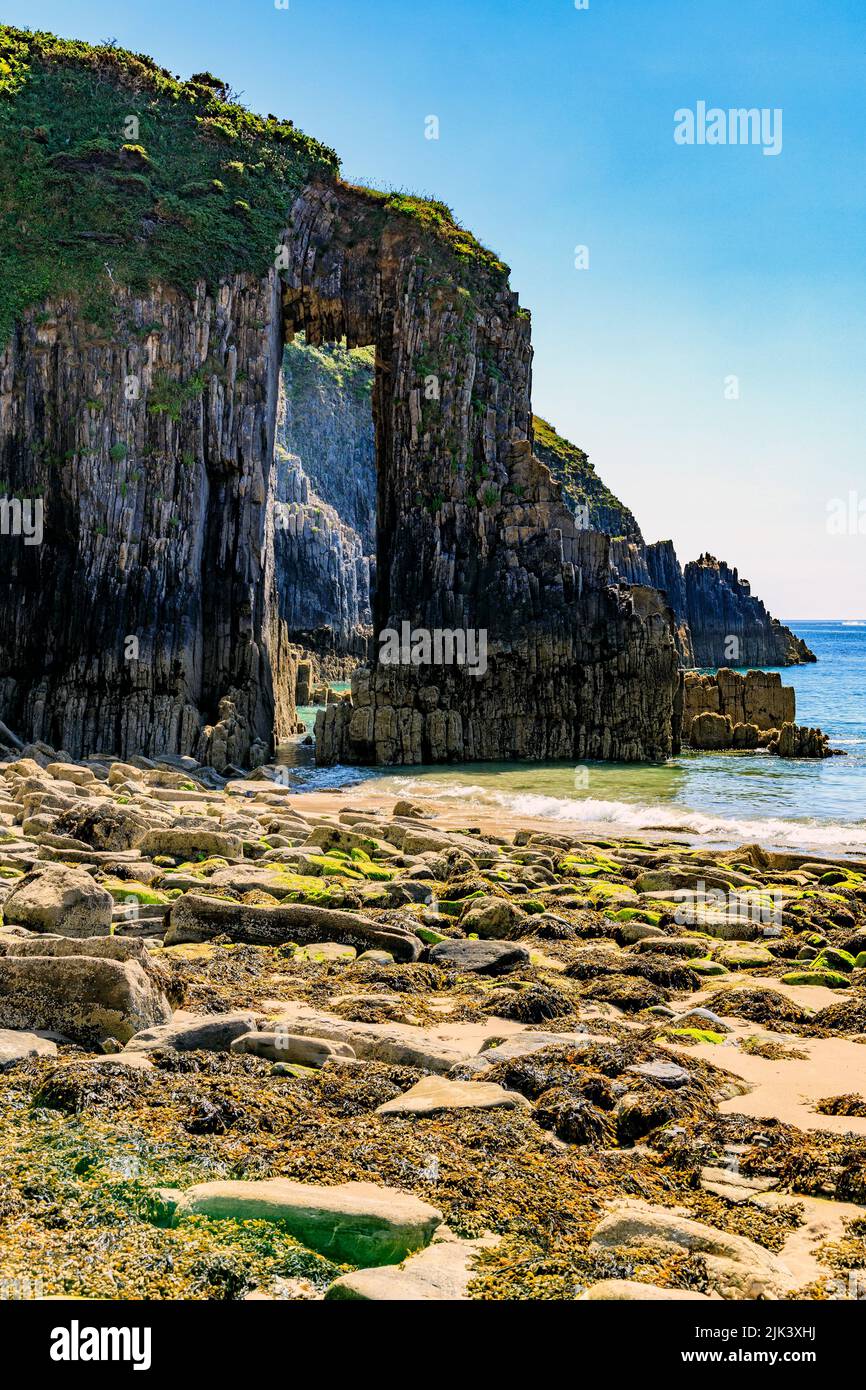 The dramatic limestone arch known as Church Doors on the Pembrokeshire ...
