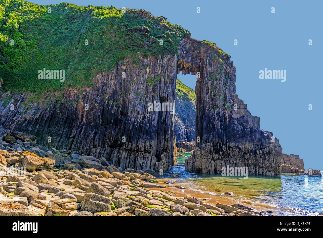 The dramatic limestone arch known as Church Doors on the Pembrokeshire ...