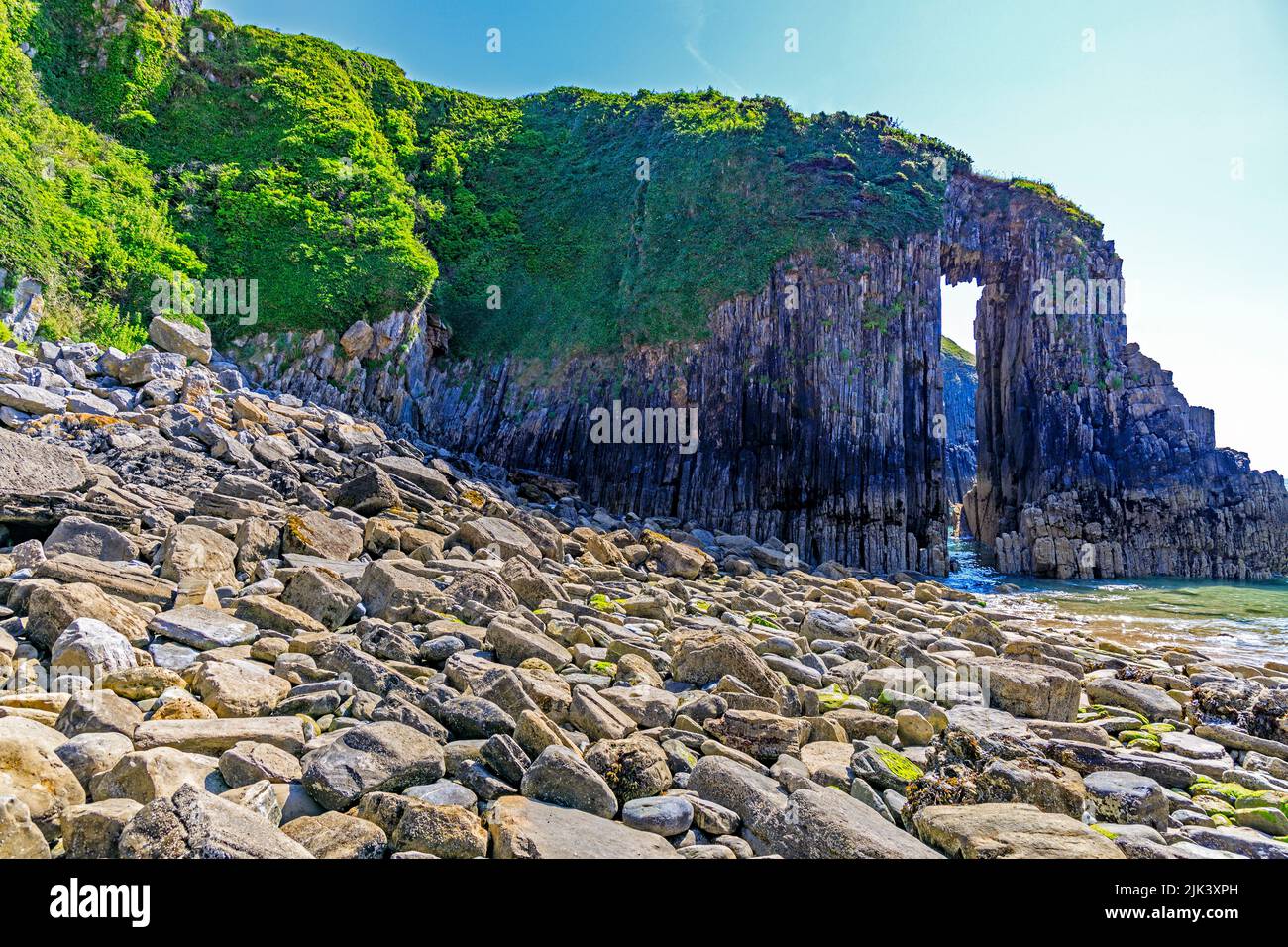 The dramatic limestone arch known as Church Doors on the Pembrokeshire ...