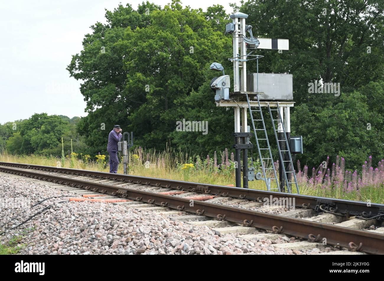 A member of the locomotive crew making a phone call about the signal ...