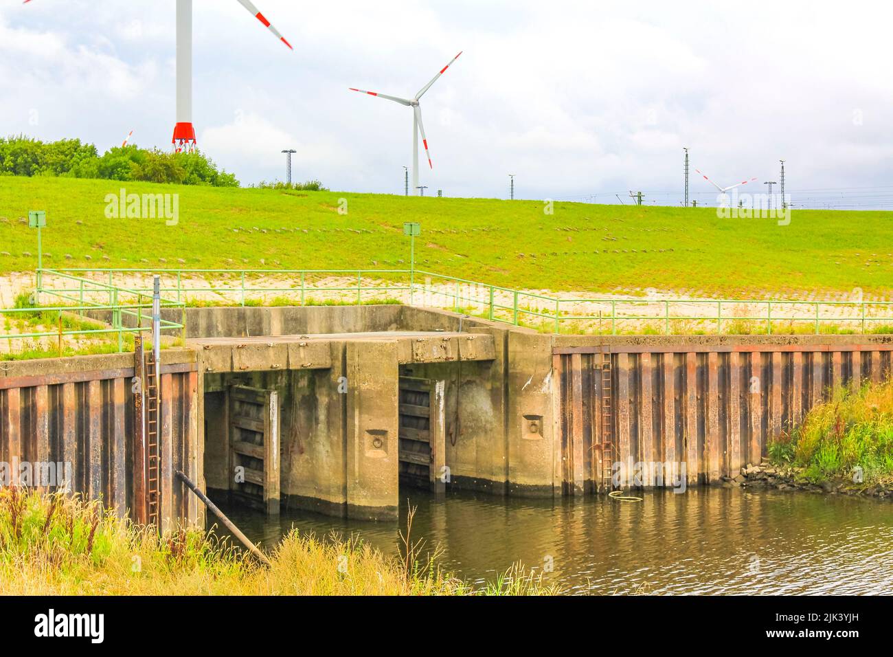 Industrial area cranes and red tower lighthouse with beautiful ...