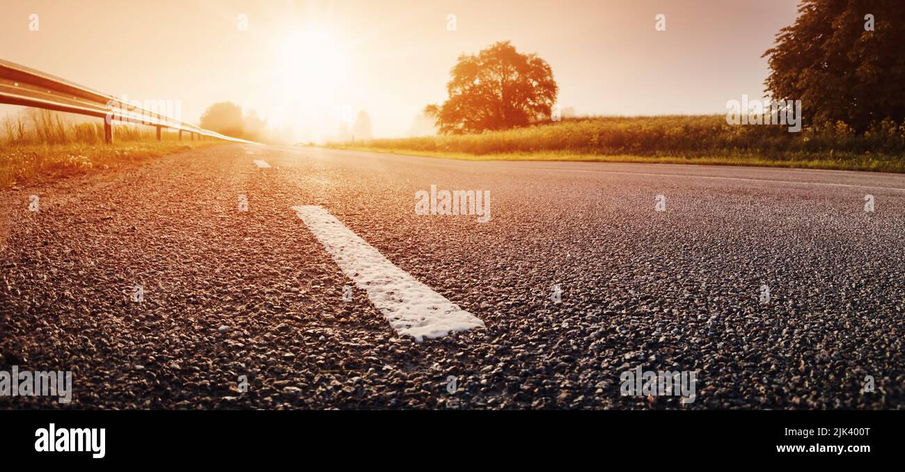 Black Asphalt Road And White Dividing Lines Stock Photo - Alamy