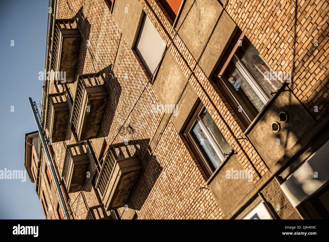 Detail of Facade of an old brick tower block Stock Photo - Alamy