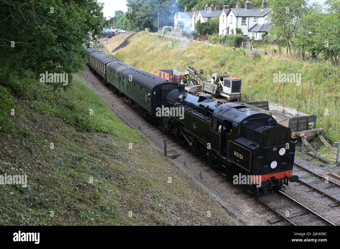 A standard class 4MT tank engine pulling out of Horsted Keynes station ...